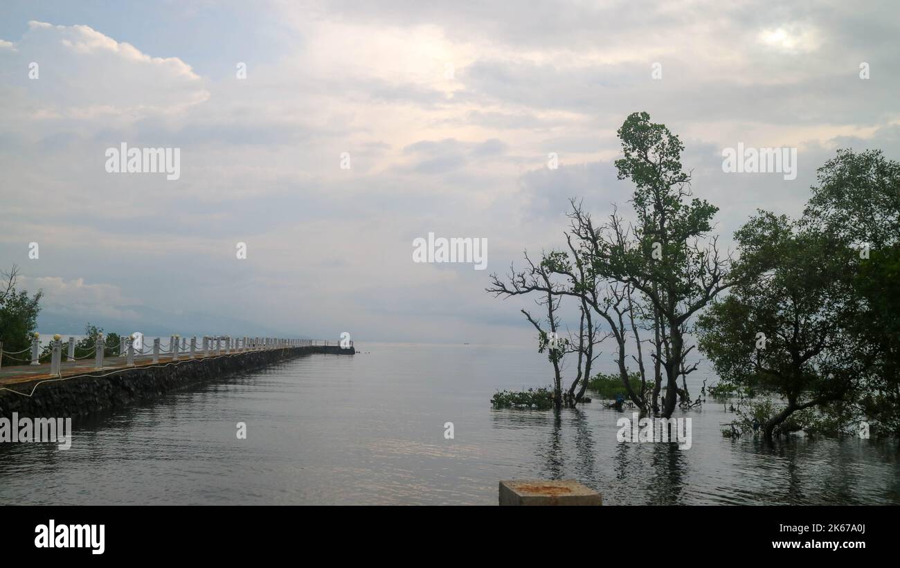 an amazing pier on the beautiful Manado beach Stock Photo - Alamy