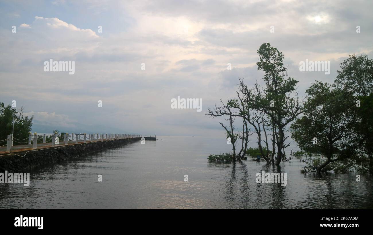 an amazing pier on the beautiful Manado beach Stock Photo - Alamy