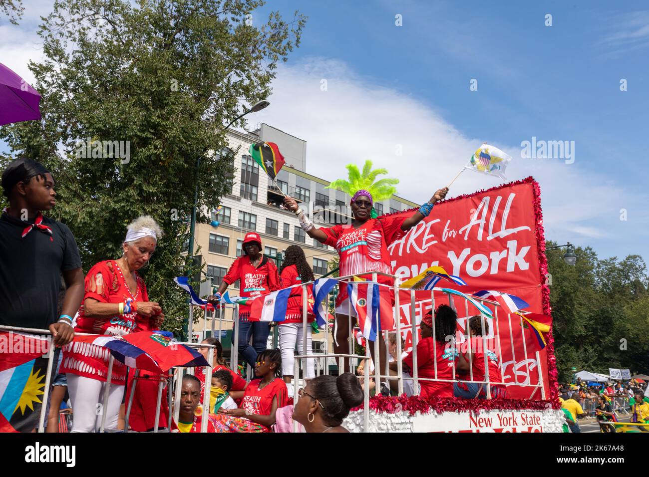 The West Indian Labor Day Parade with a woman holding a Virgin Islands ...