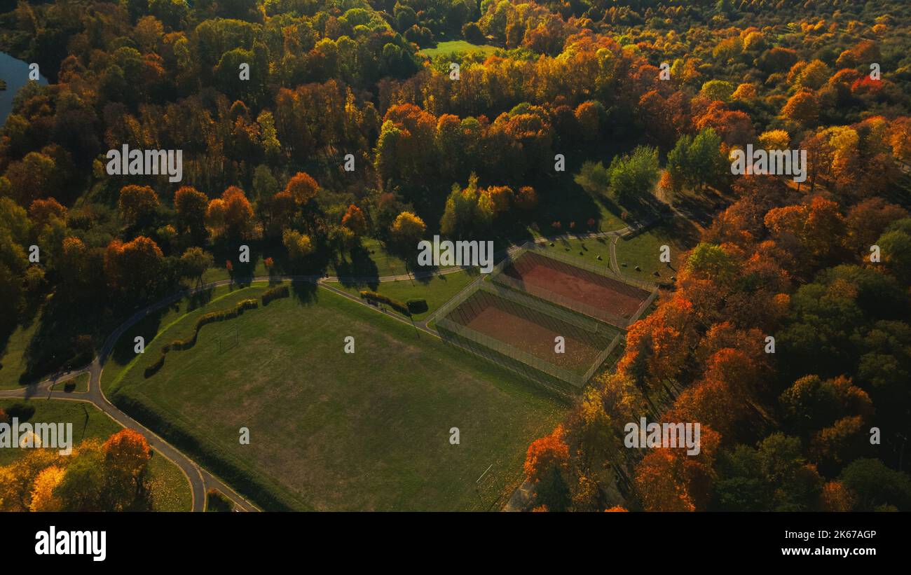 Autumn city park. Trees with colorful leaves. Sports grounds. Autumn ...