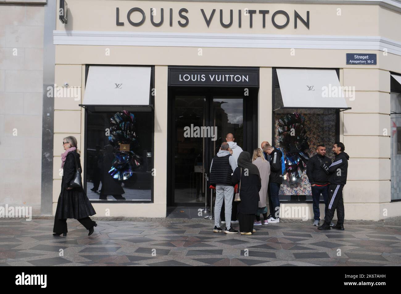 Copenhagen -Denmark -12 October 2022- Louis vuittons shoppers witing at store on stroeget in ...