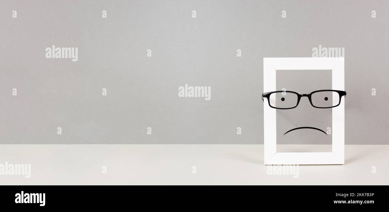 Frame with a sad face, mental health concept, negative mindset ...