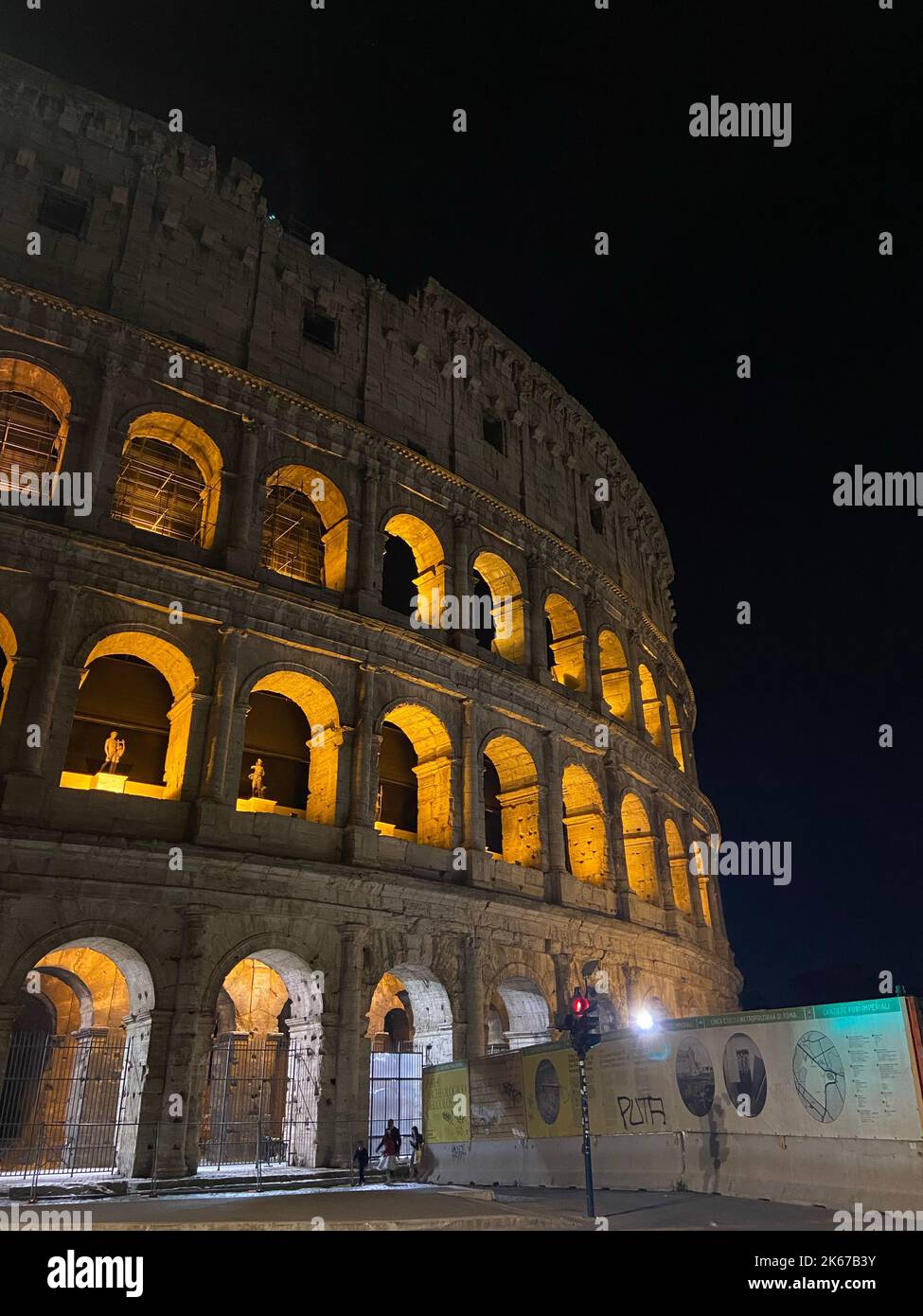 A vertical shot of the Colloseum in Rome by night Stock Photo - Alamy