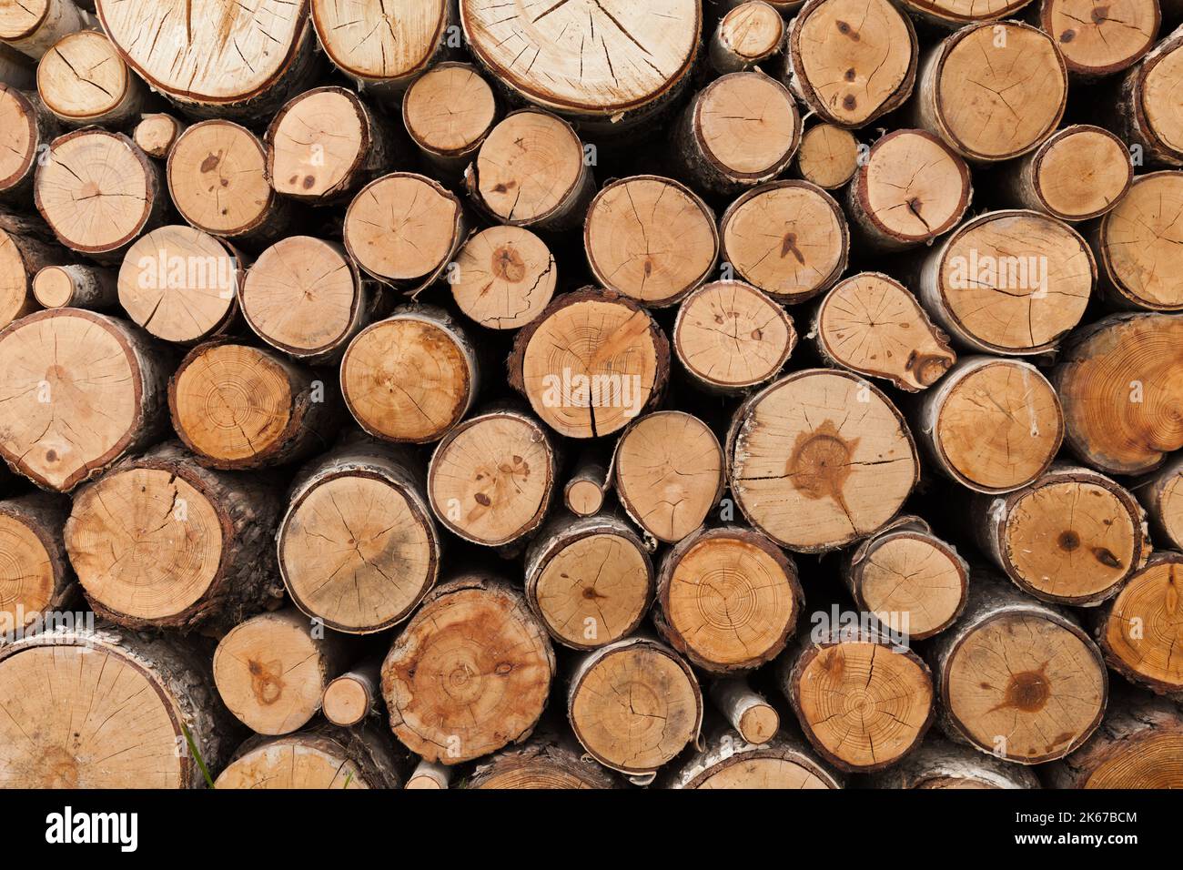 Stacked wooden logs, abstract background photo texture Stock Photo - Alamy