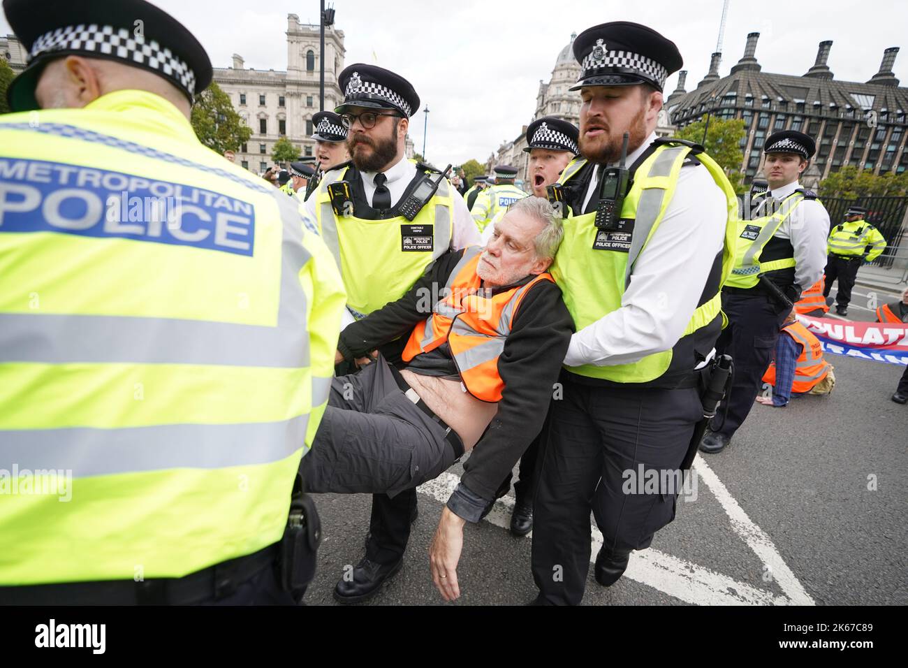 Police officers carry away a man hi-res stock photography and images ...