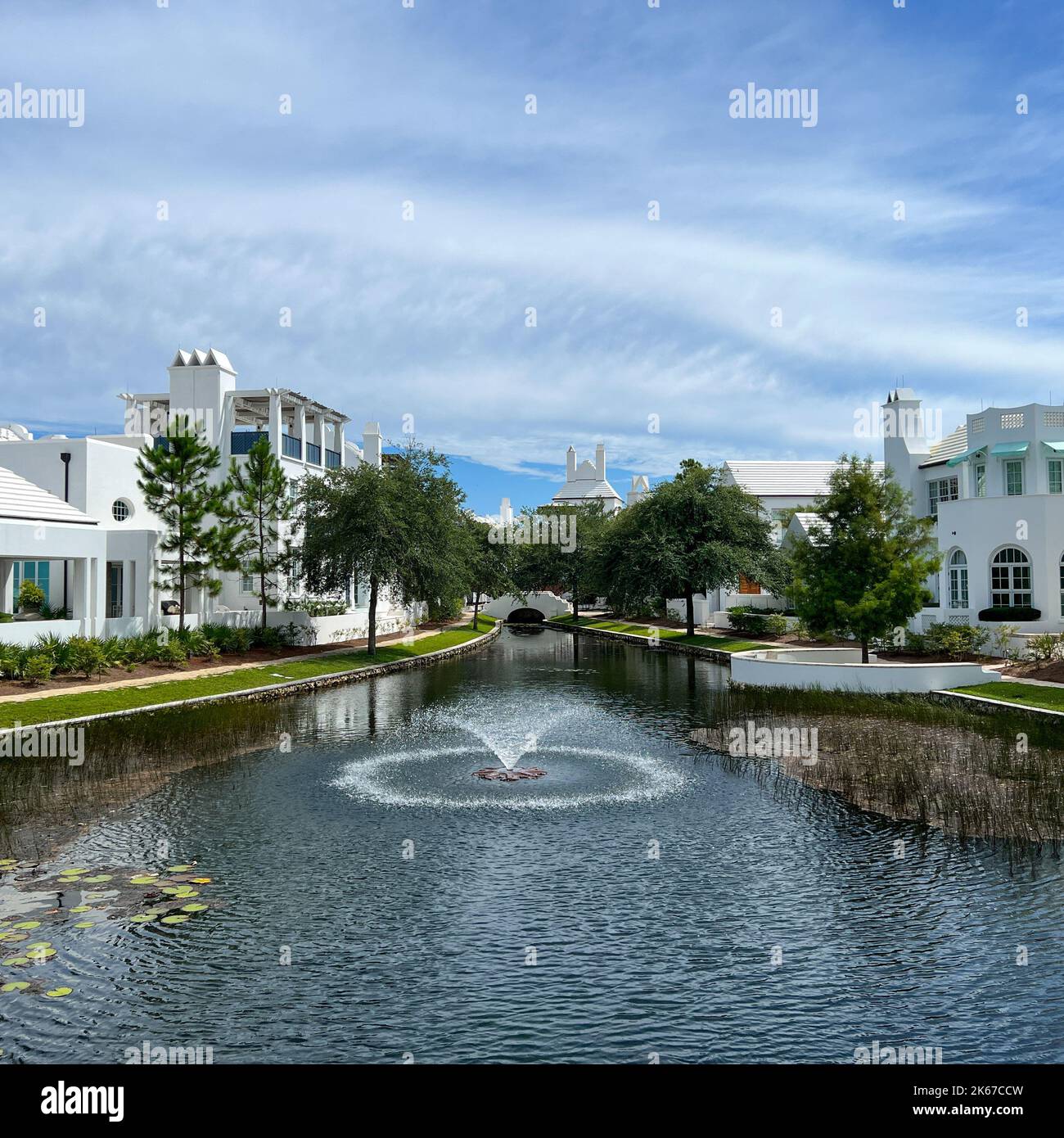 Alys Beach, FL USA - July 26, 2022: A walking path with water feature ...