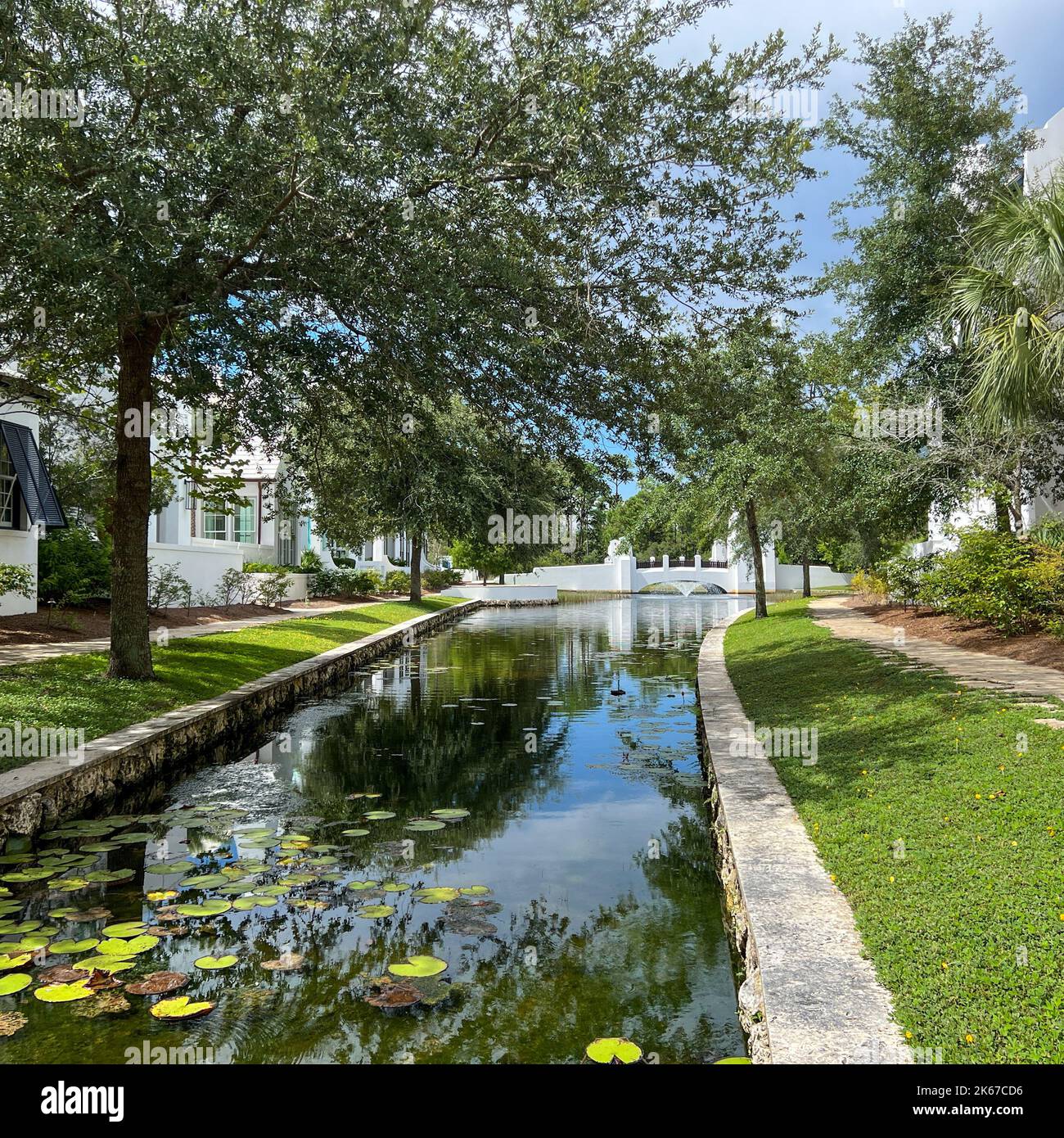 Alys Beach, FL USA - July 26, 2022: A walking path with water feature ...