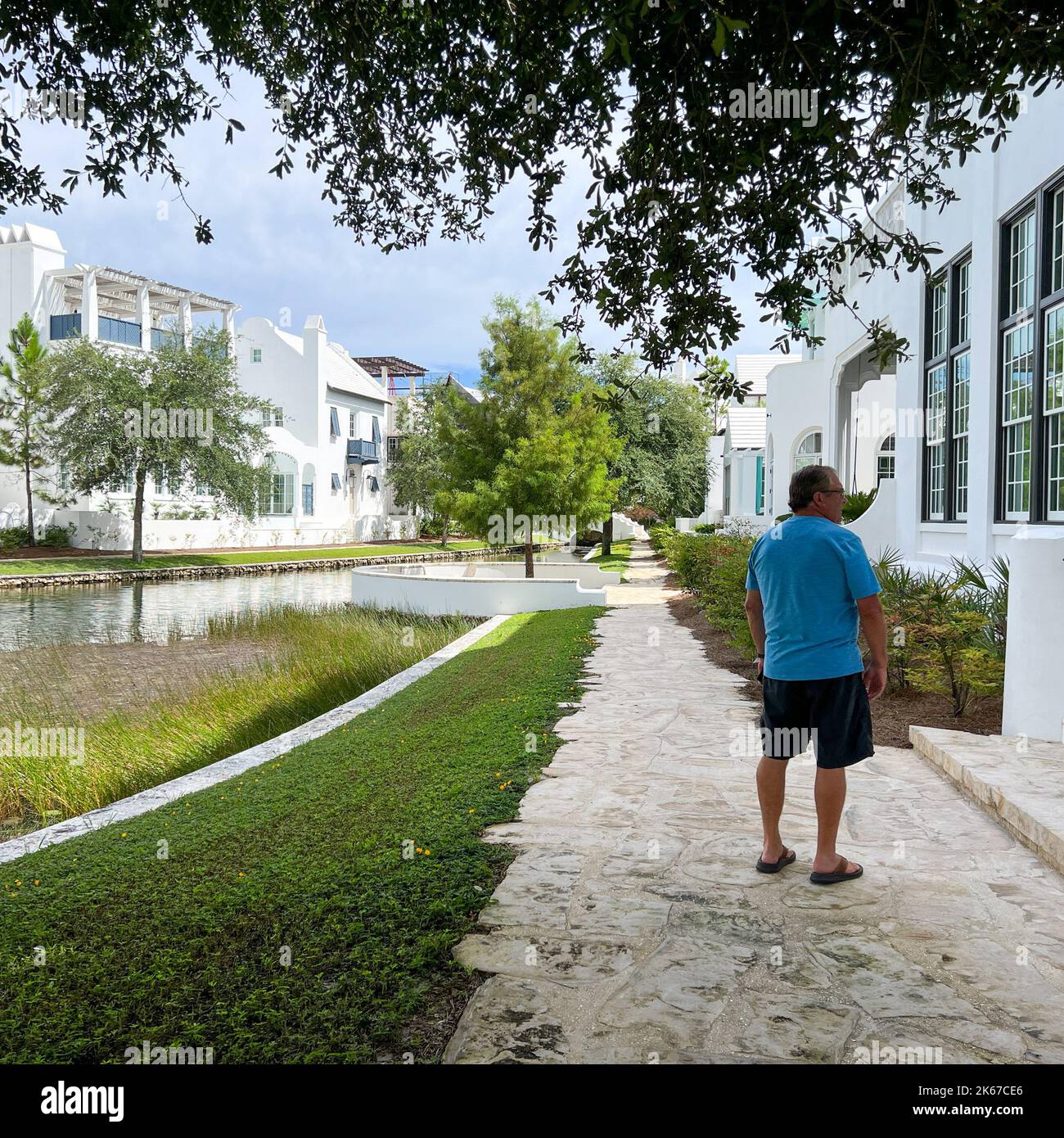 Alys Beach, FL USA - July 26, 2022: A walking path with water feature ...