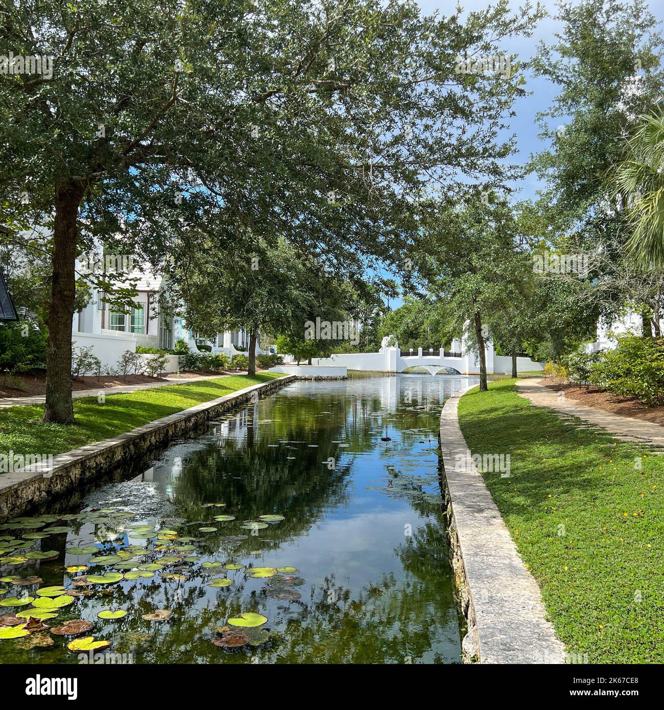 Alys Beach, FL USA - July 26, 2022: A walking path with water feature ...