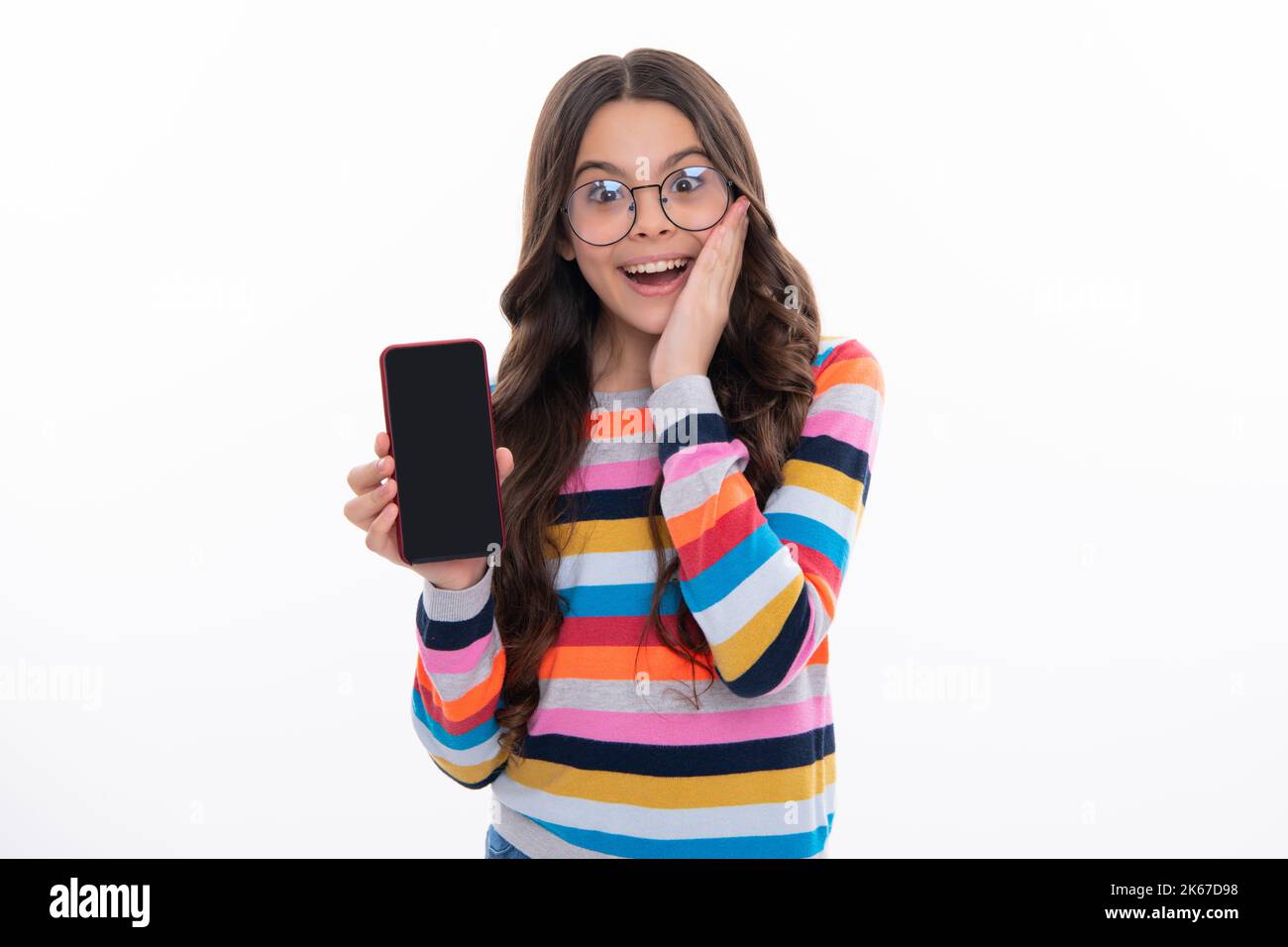 Mobile online shopping. Cute teen child girl paying with phone, texting ...