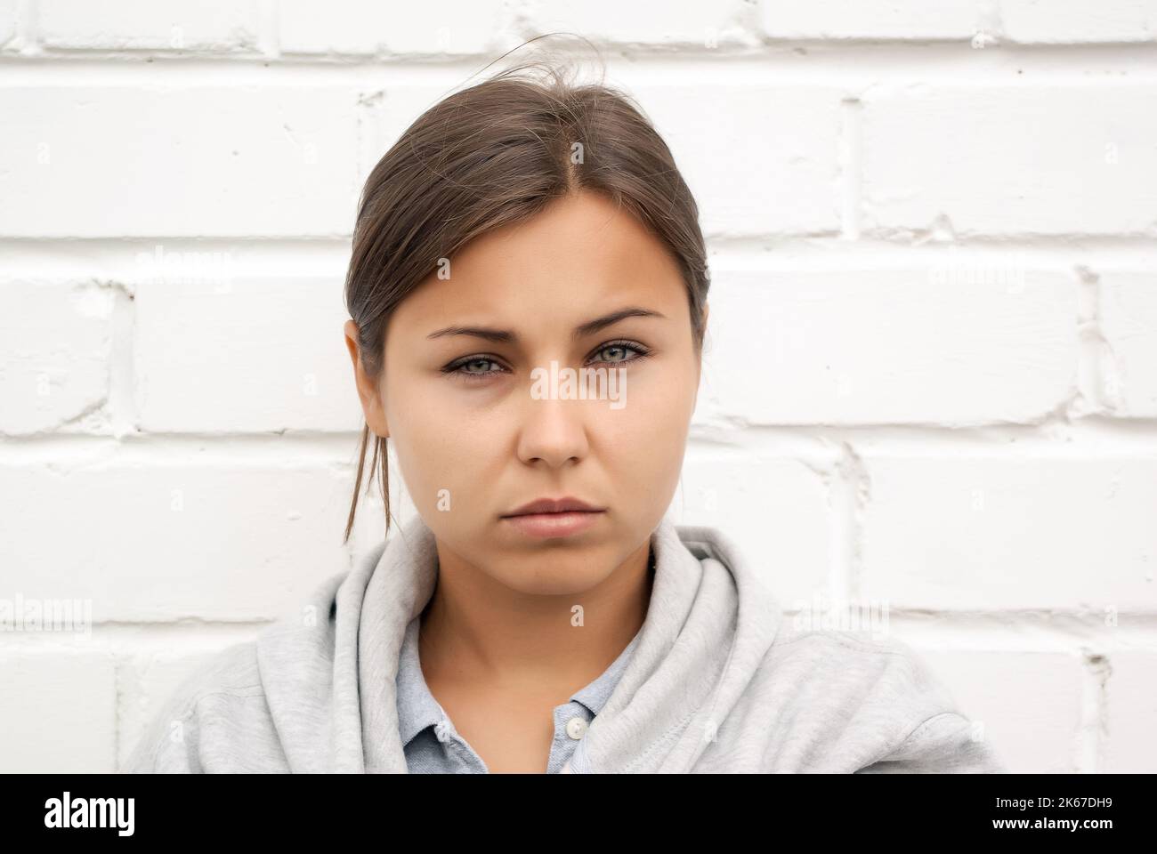 Cute young girl portrait, looking on camera, sad Stock Photo - Alamy