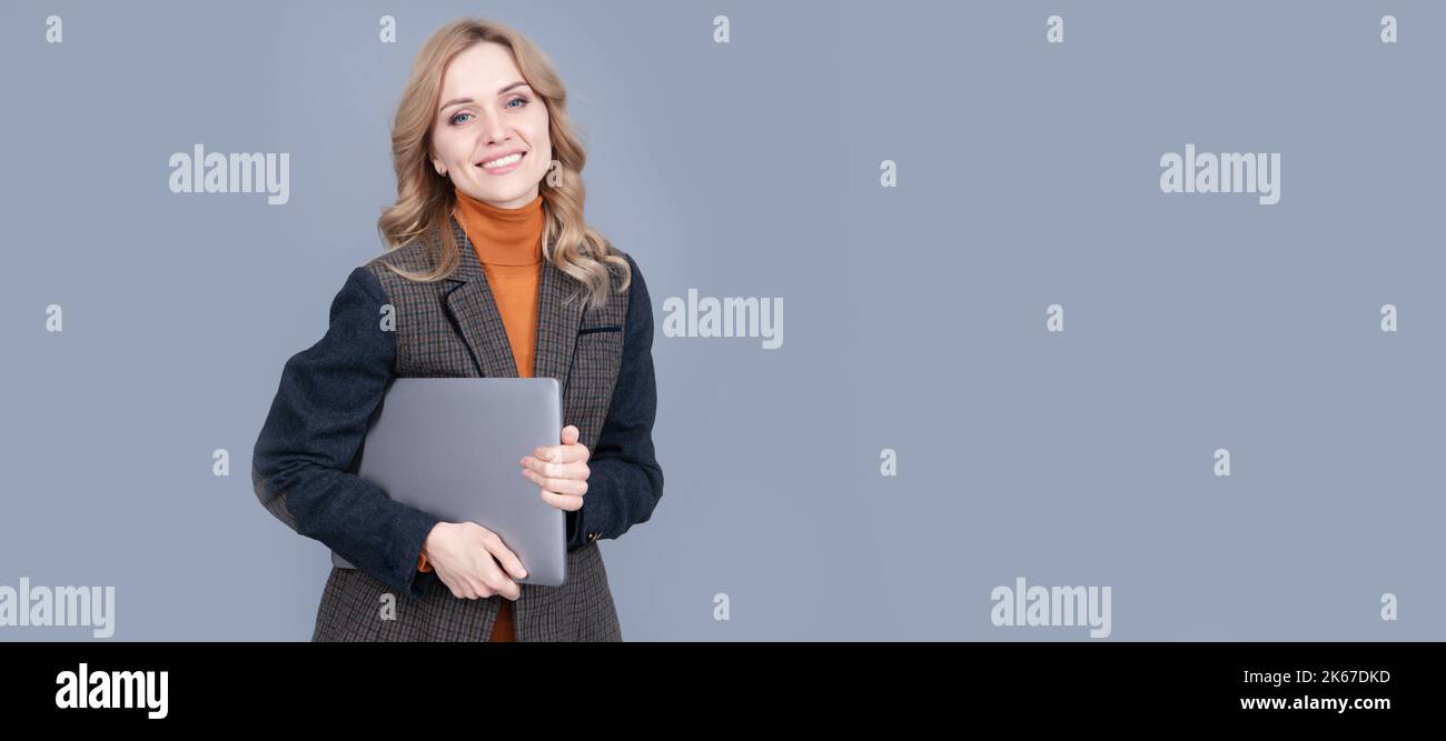 Happy woman in casual fashion style hold portable laptop computer grey ...