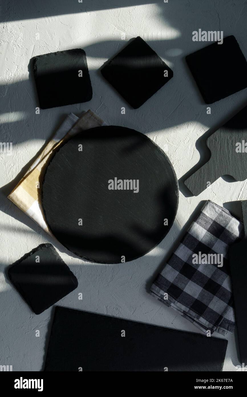 Various cooking boards made of slate white background, top view, space ...