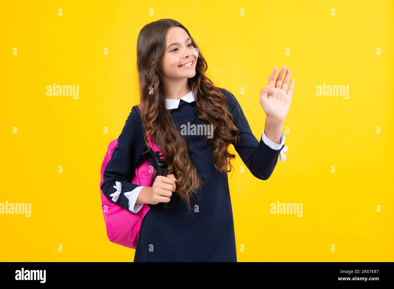 Schoolgirl in school uniform with school bag. Teenage girl student on ...