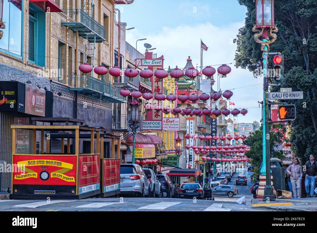 Rows of traditional Chinese red lanterns are strung across the street ...