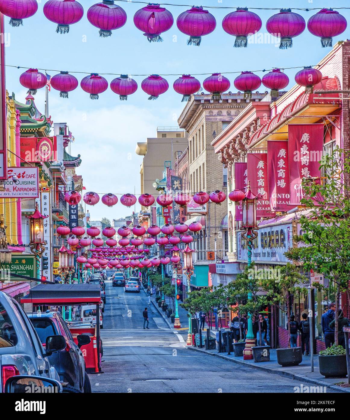 Rows of traditional Chinese red lanterns are strung across Grant Avenue ...