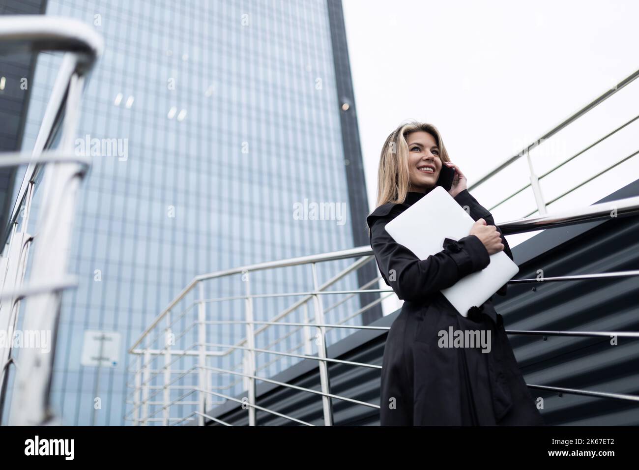 successful business woman on the background of a modern office building ...