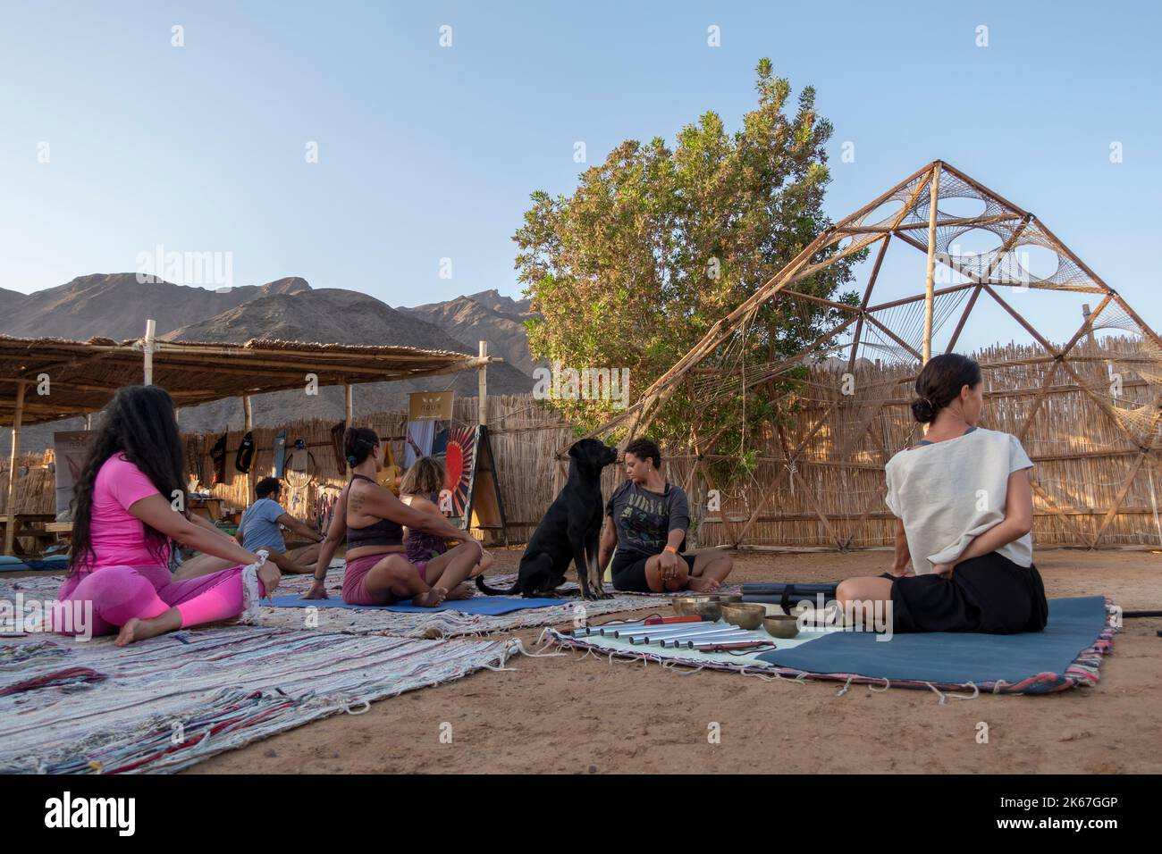 Tourists and Egyptian women practice Yoga in Ras el Satan or Ras ...