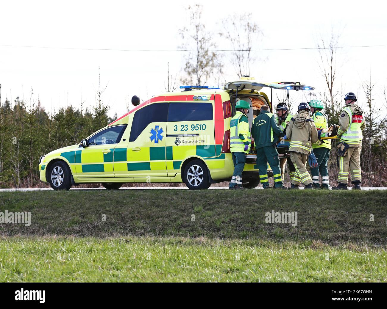 Ambulance on site at a traffic accident Stock Photo - Alamy