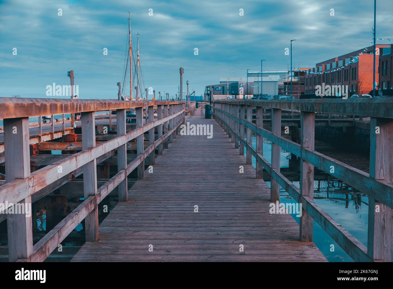An old wooden walkway at a dock Stock Photo - Alamy