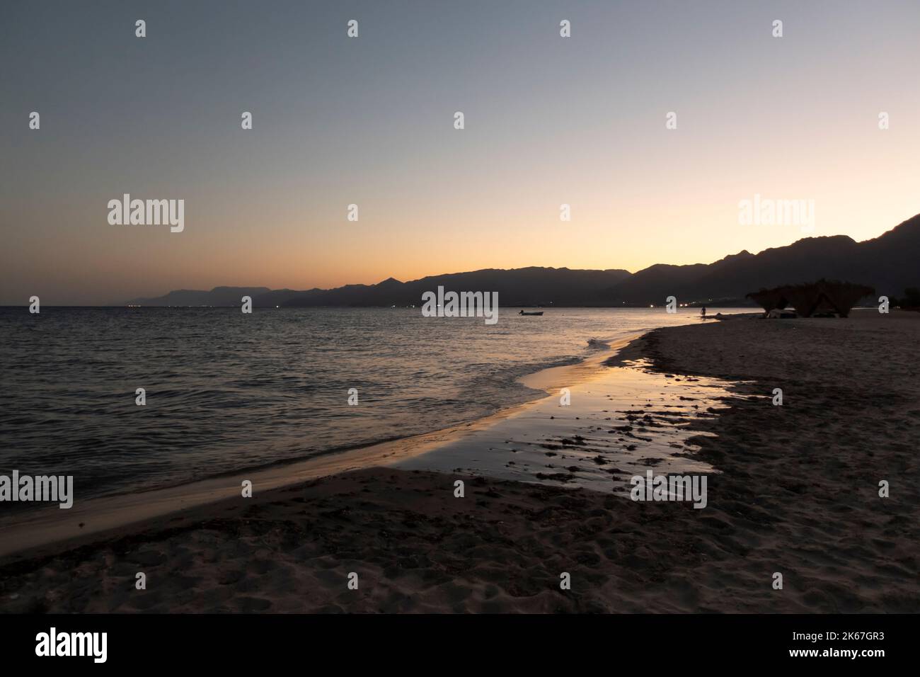 Sunset over Ras el Satan or Ras Shaitan beach resort area north of ...