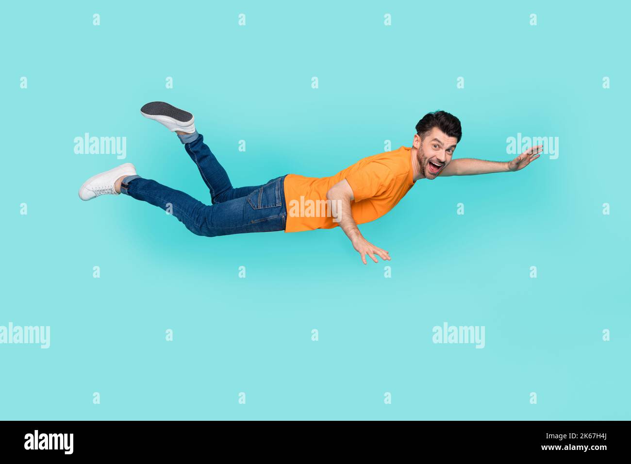 Full length photo of guy falling down in air feeling cheerful surprise ...