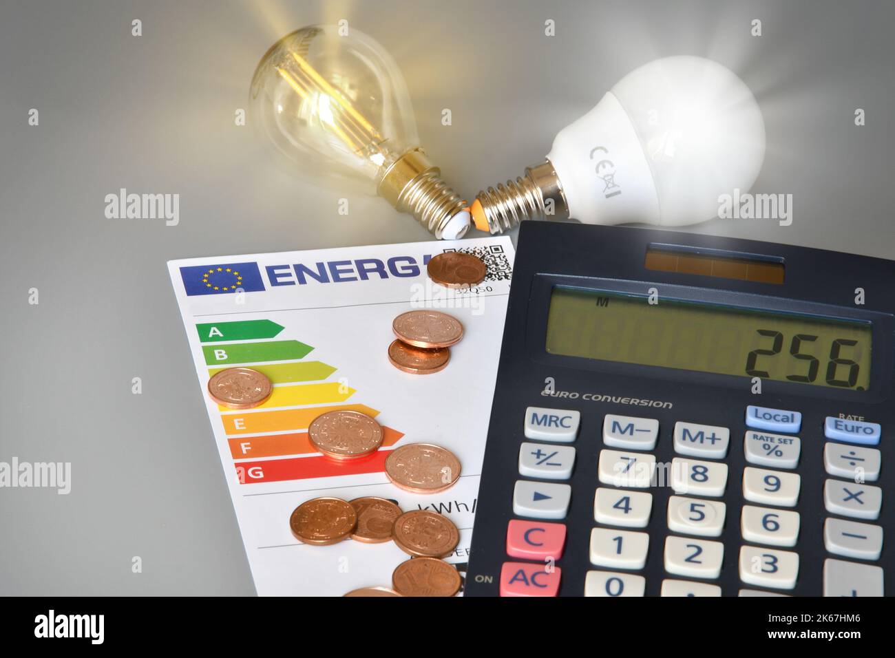 Energy efficiency rating table with illuminated light bulbs, calculator ...