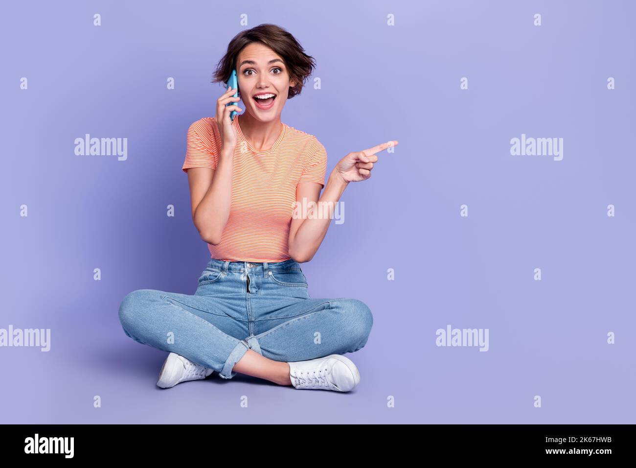 Full size photo of cute young girl talk phone point impressed empty ...