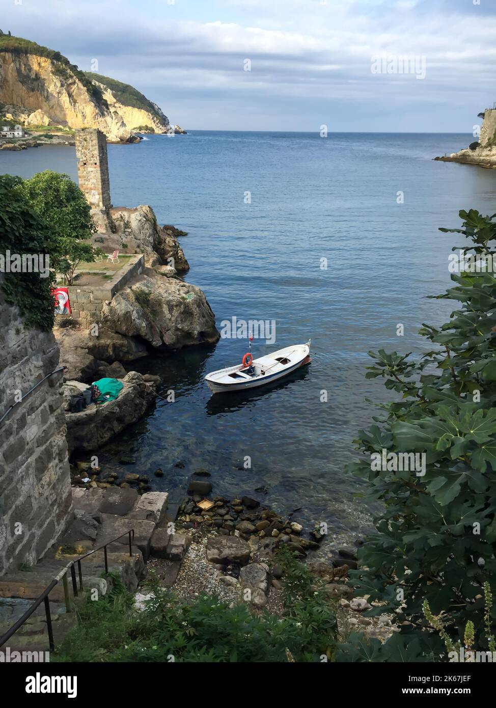 Coastal view of the small black sea port town with rowing boat at ...