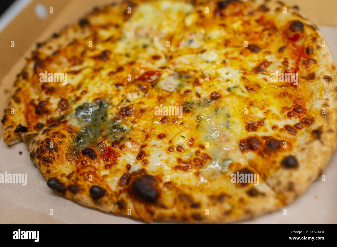 Real italian quattro formaggi cheese pizza Stock Photo - Alamy