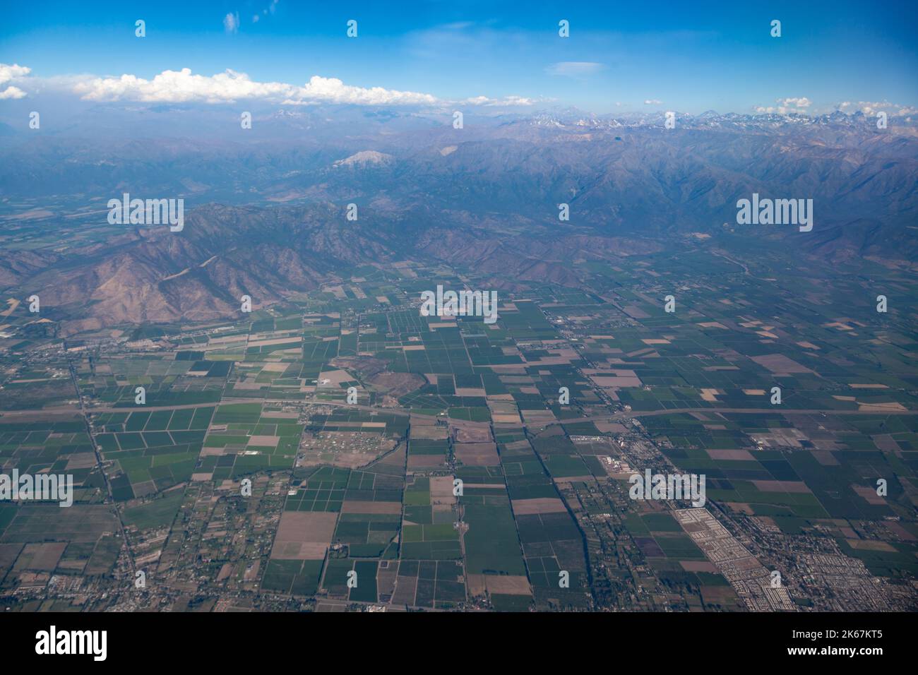 The Andes mountains in Chile and the countryside farmlands from an ...