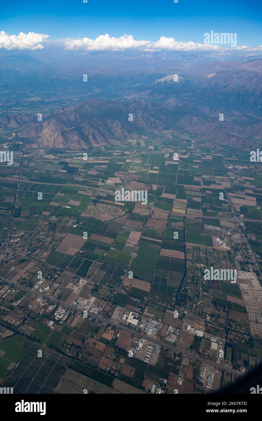 The Andes mountains in Chile and the countryside farmlands from an ...