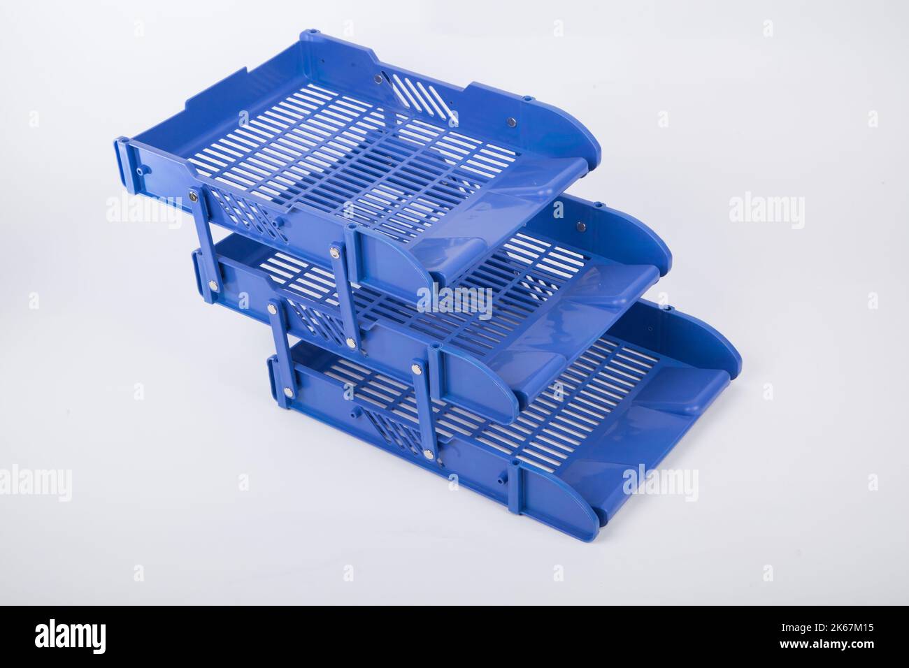 A closeup of blue horizontal tray for A4 papers isolated on white ...