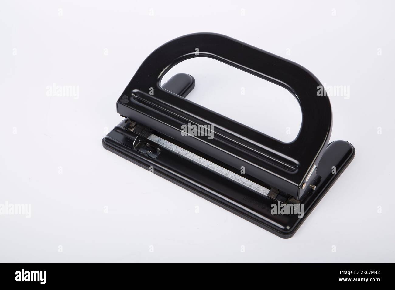 A closeup of metal paper hole punch isolated on white background Stock ...