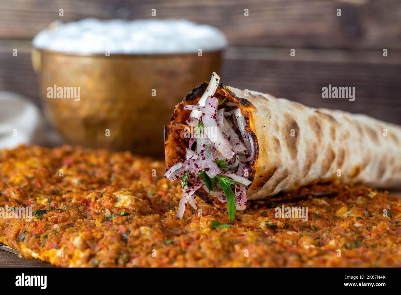 Lahmacun or Turkish pizza with minced meat on a wood background ...