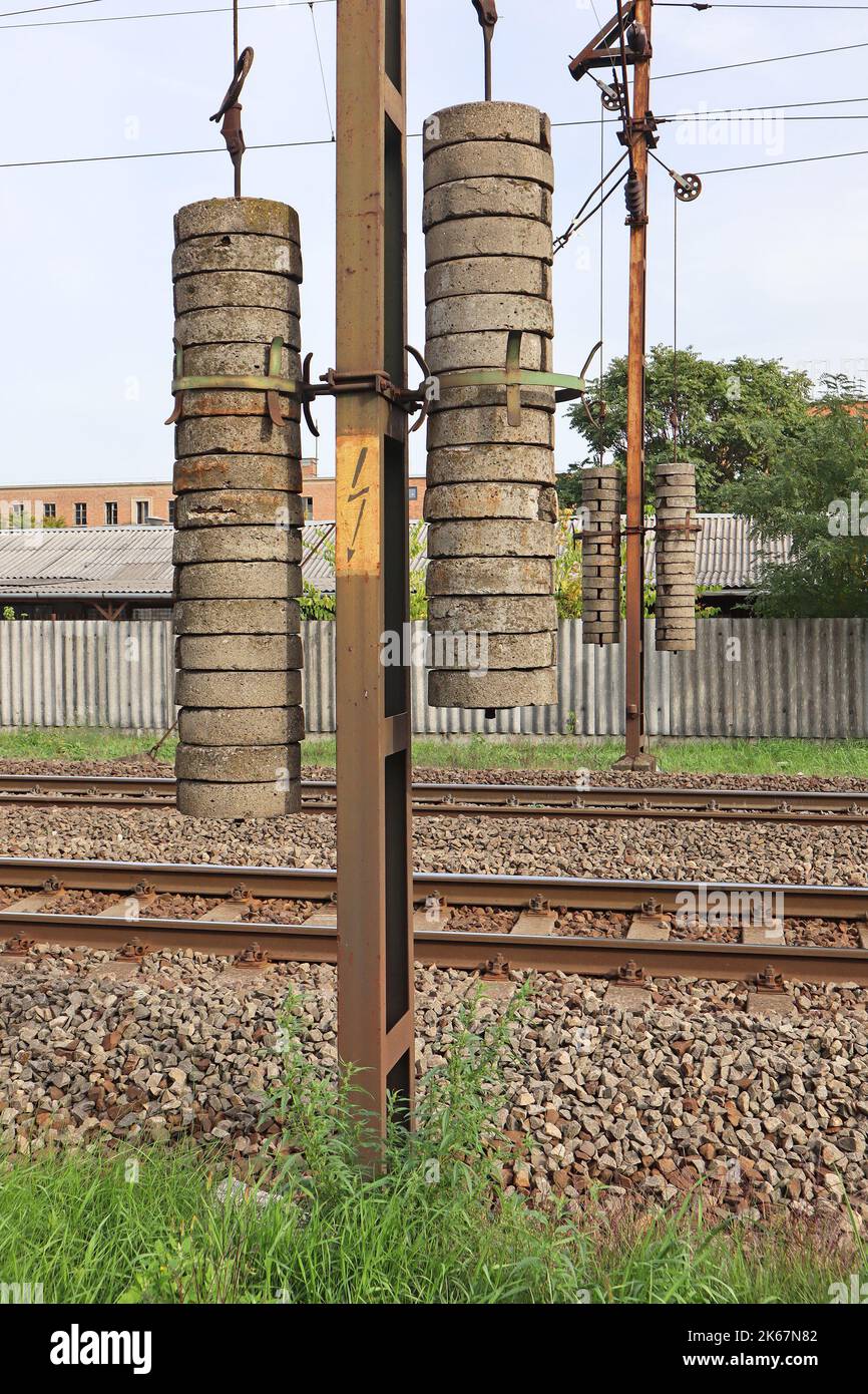 Concrete counterweights next to the railway tracks Stock Photo - Alamy