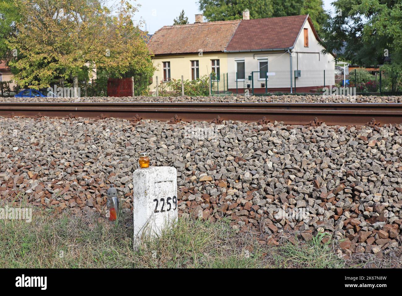 Lantern on the mile stone next to a railway Stock Photo - Alamy