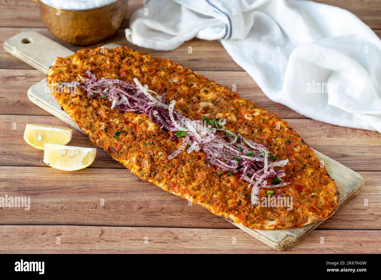 Lahmacun or Turkish pizza with minced meat on a wood background ...