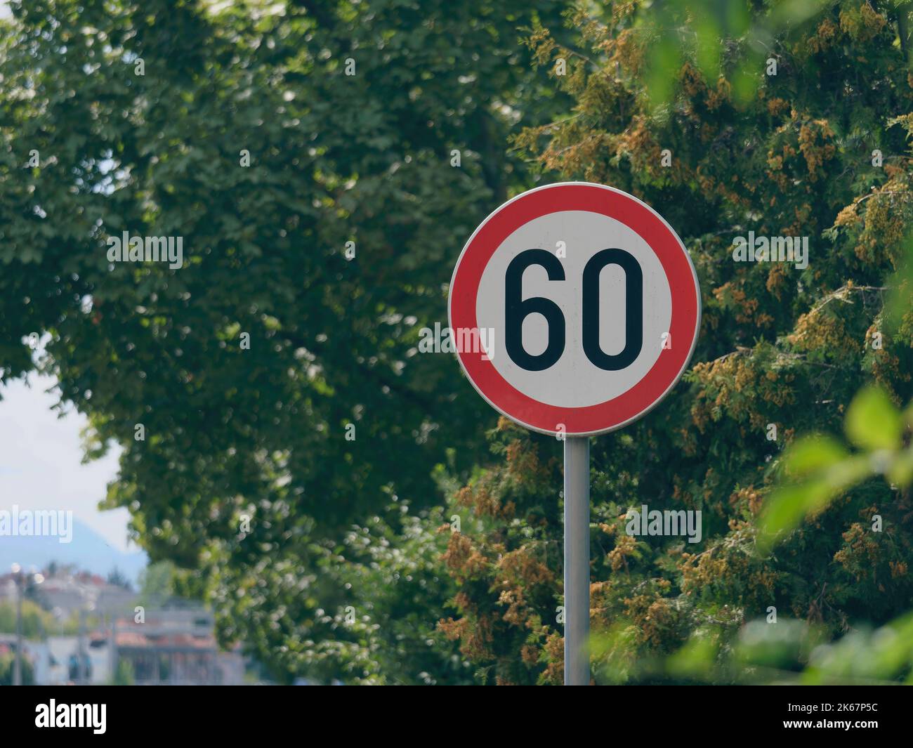 A close shot of the 60 limit traffic signboard placed outdoors Stock ...