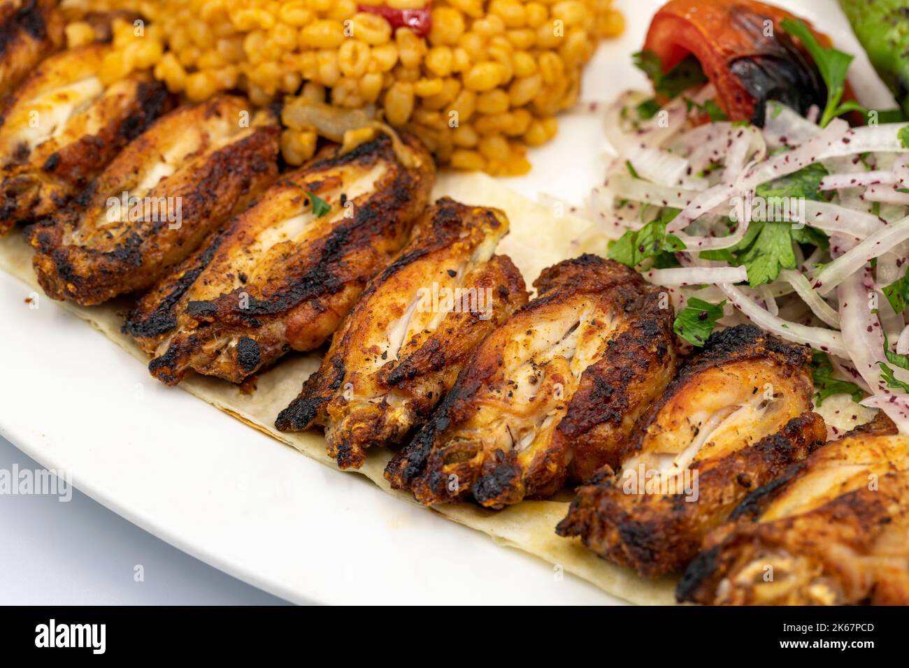 Grilled chicken wings skewers isolated on white background. Turkish ...