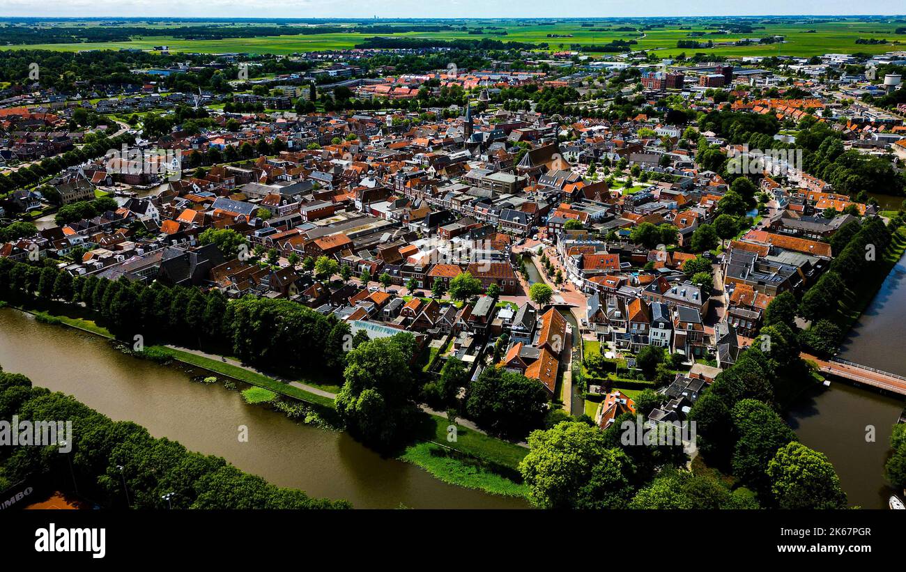 An aerial shot of the beautiful Dokkum city surrounded by a river ...