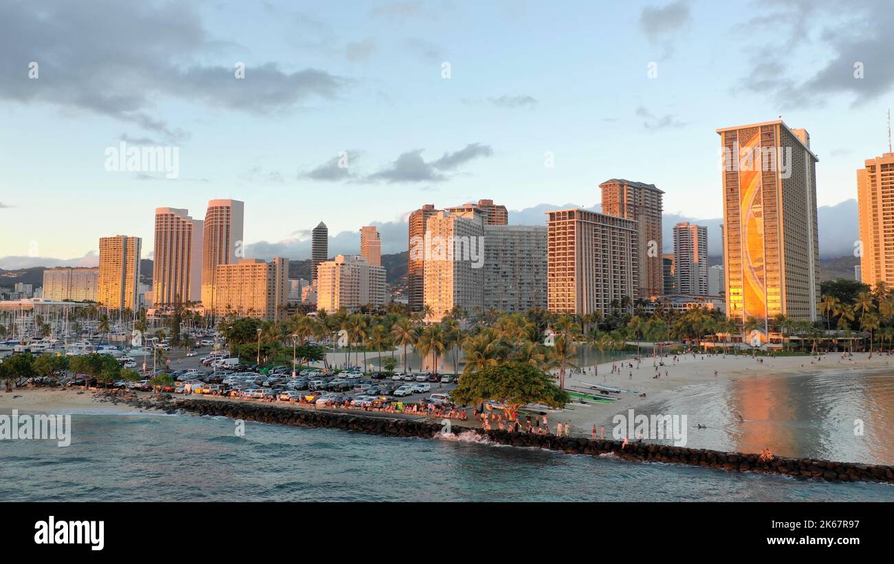 An aerial view of cityscape Honolulu surrounded by buildings and water ...