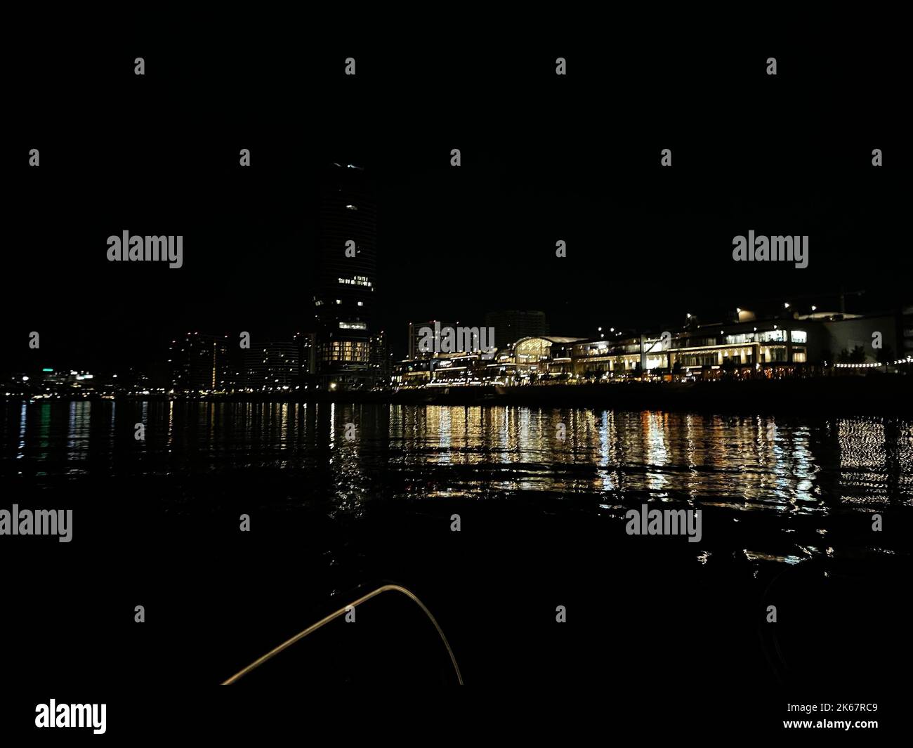 A charming view of waterside city at night Stock Photo - Alamy