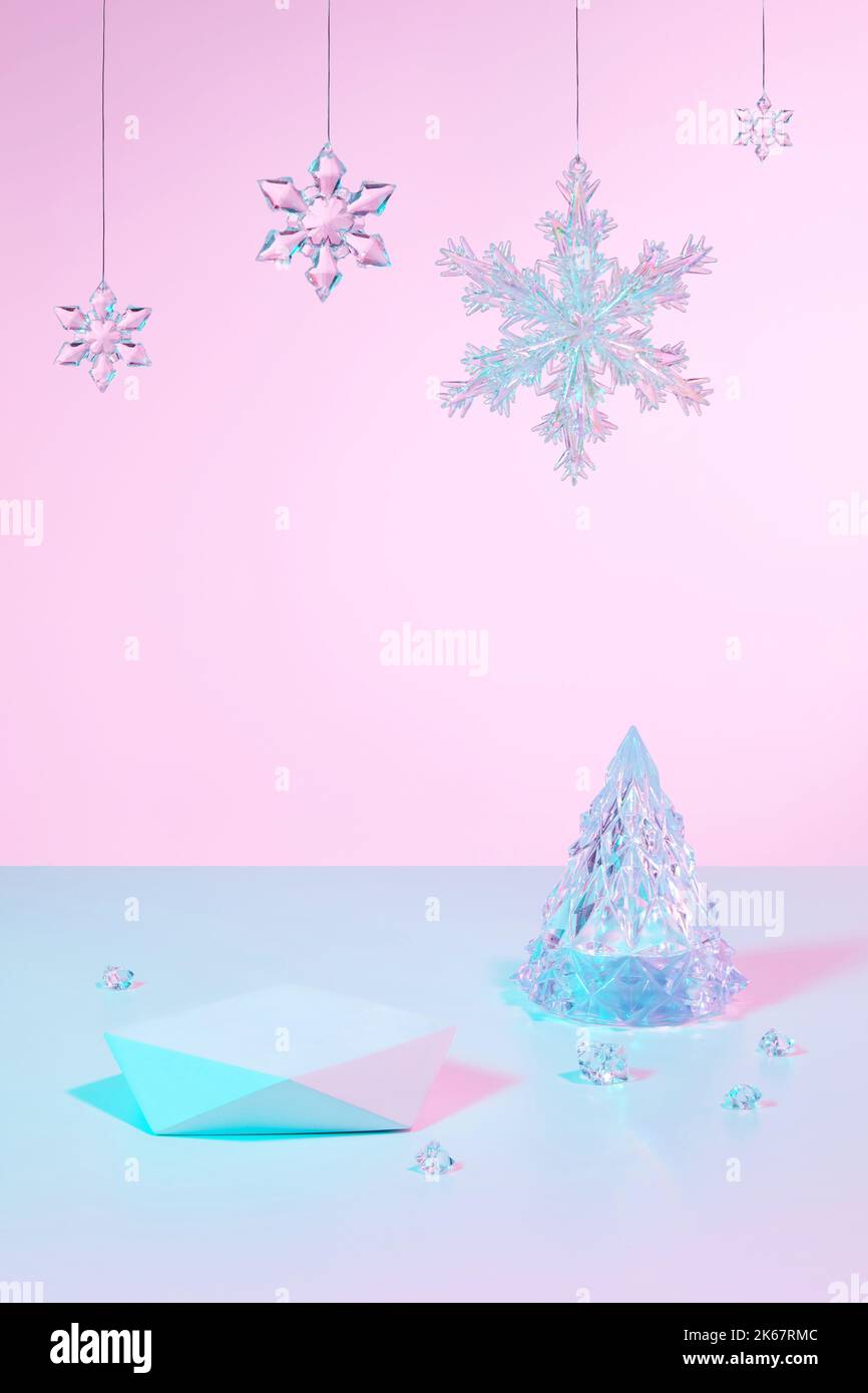Winter scene with Christmas decorations on holographic pink background ...
