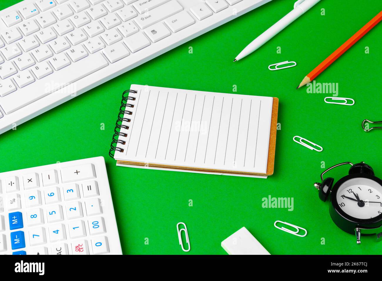 Green office desk with white stationery, copy space Stock Photo - Alamy