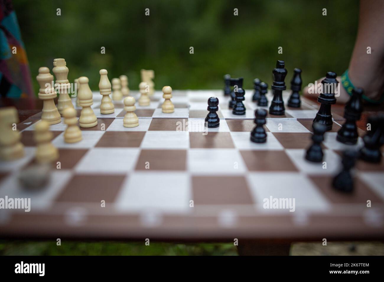 A chess board on the wooden bench Stock Photo - Alamy