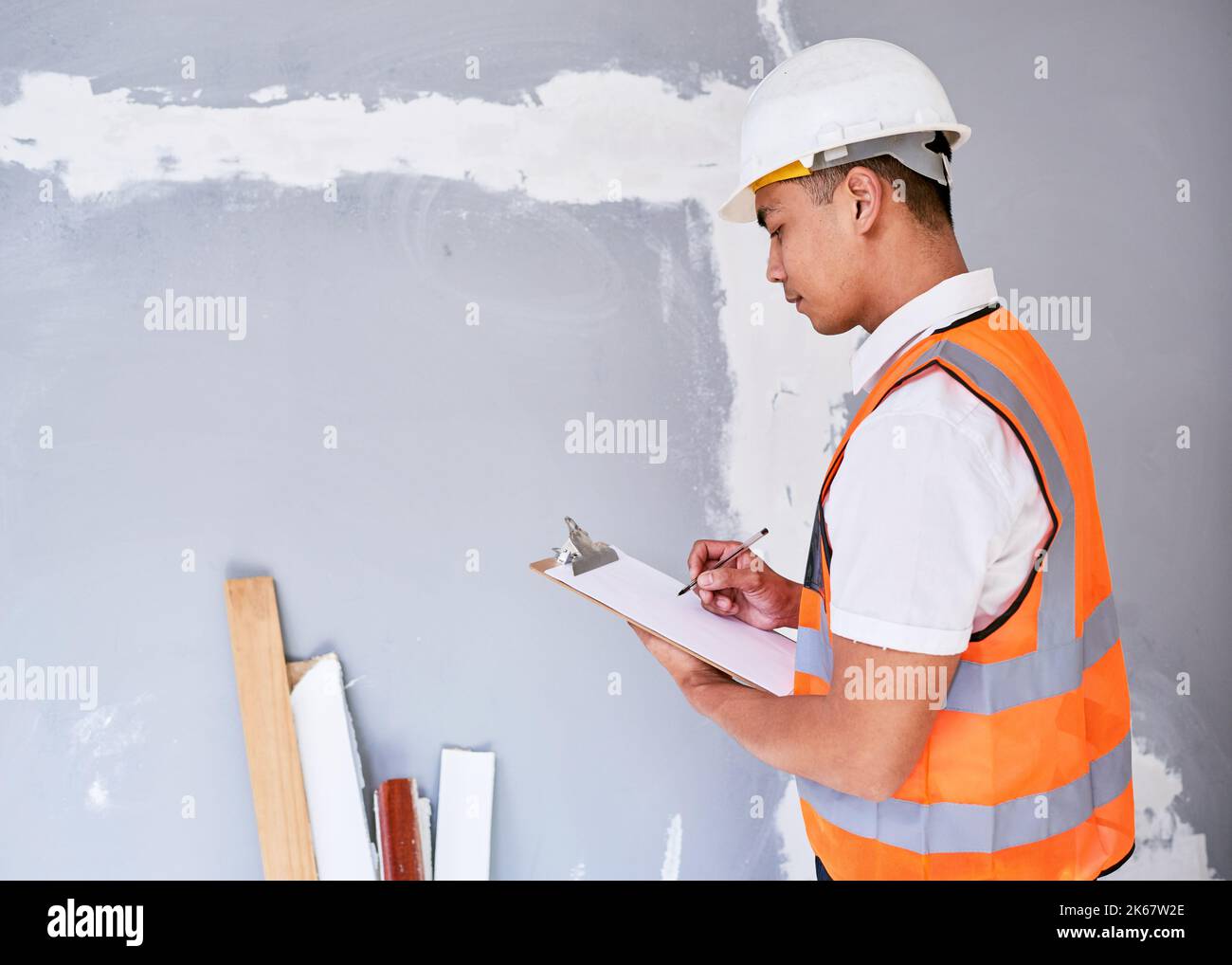 A construction supervisor checks renovation project with checklist on ...