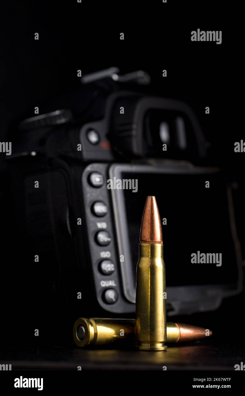 Digital Camera with Large Caliber Bullets Vertical Stock Photo - Alamy