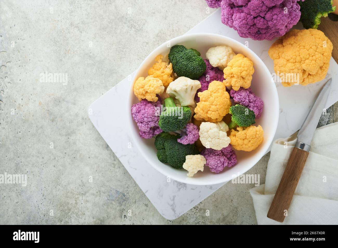 Colorfu cauliflower. Cauliflower cut into small pieces white bowl on ...
