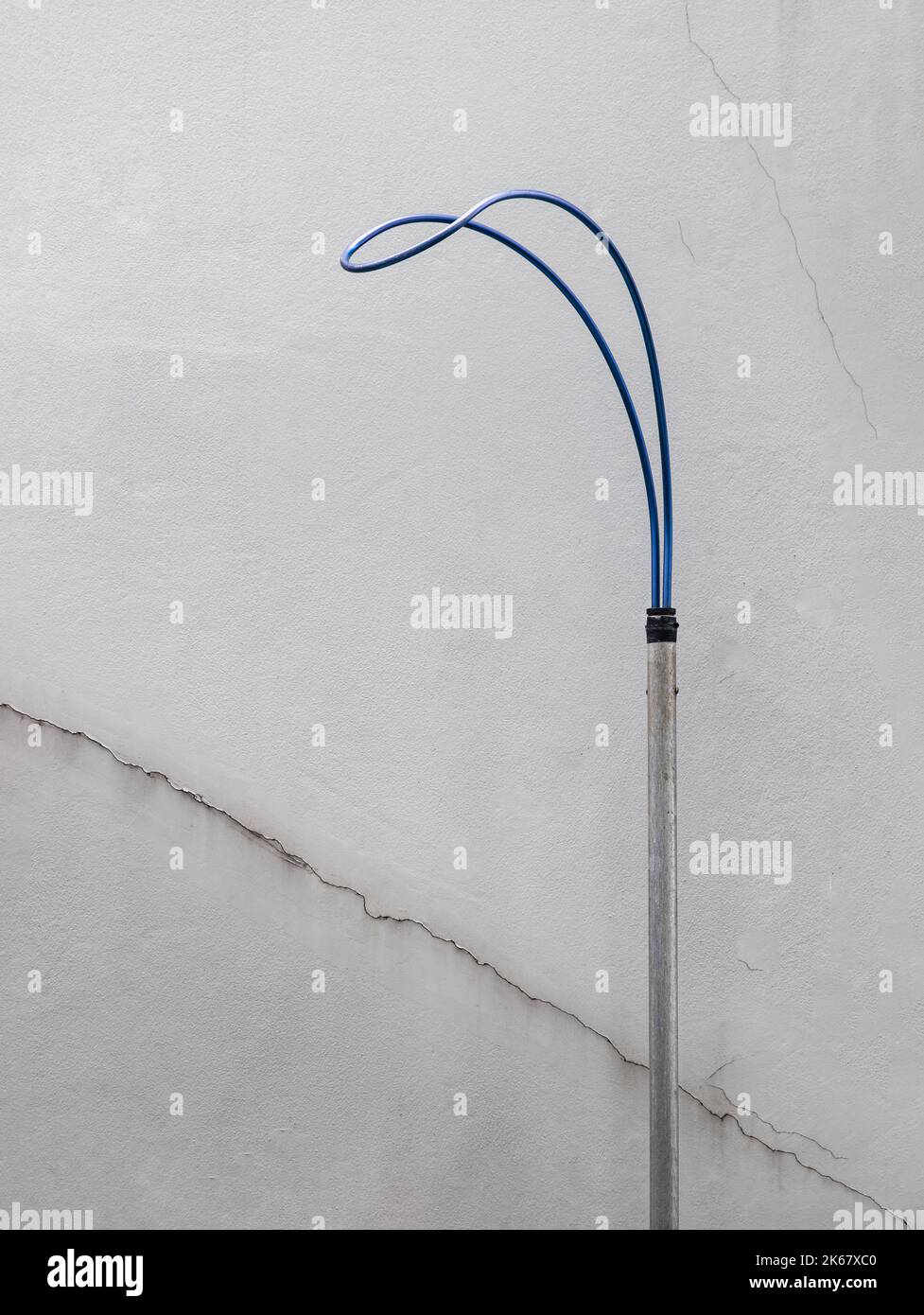 Life saving hook or Life hook front of white concrete wall near ...